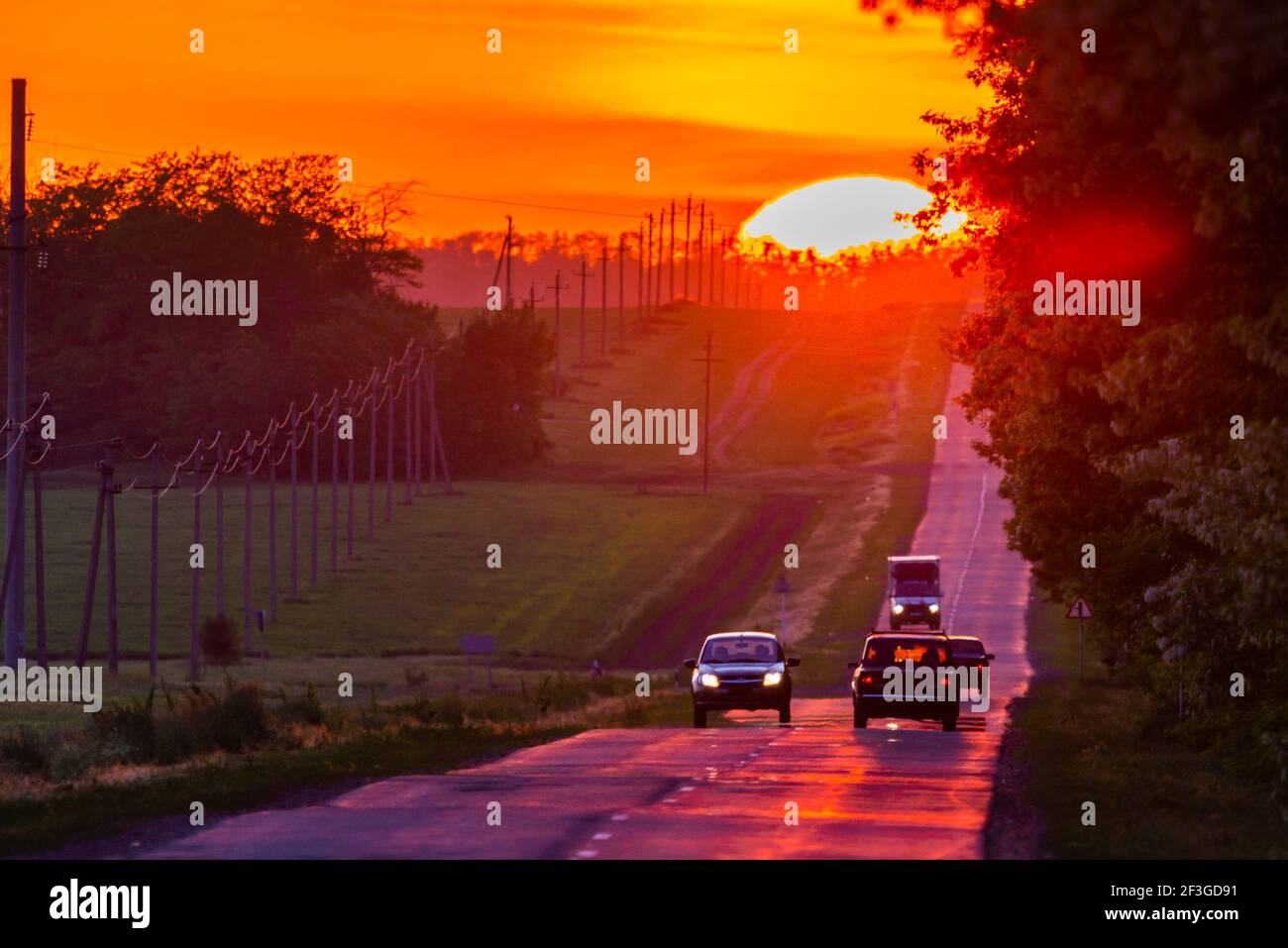 Beautiful sunset. Sundown on horizon. Traffic on a road Stock Photo - Alamy