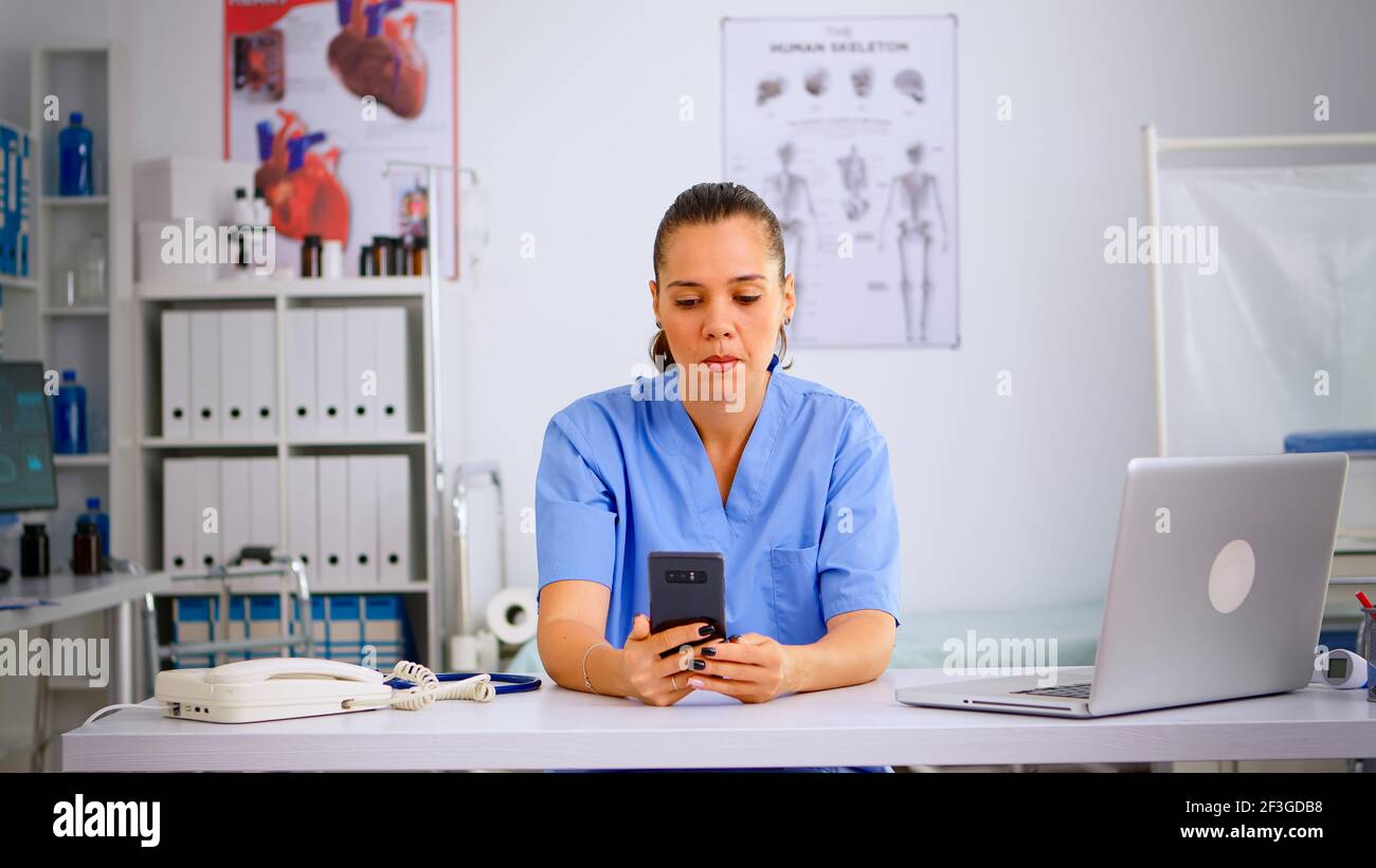 Experienced woman nurse giving online medical consultation using ...