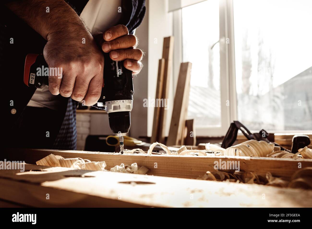 Close up of a carpenter drilling a hole in timber Stock Photo - Alamy