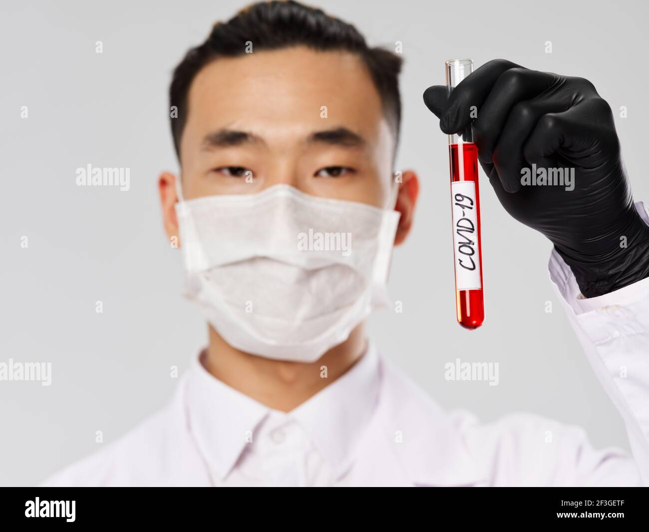 Male laboratory assistant black glove blood test diagnostics technology ...