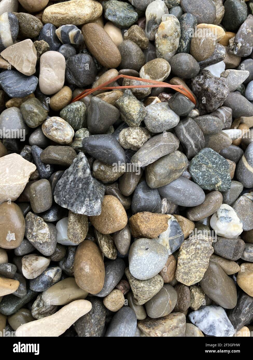 An overhead shot of smooth pebbles on the ground Stock Photo - Alamy
