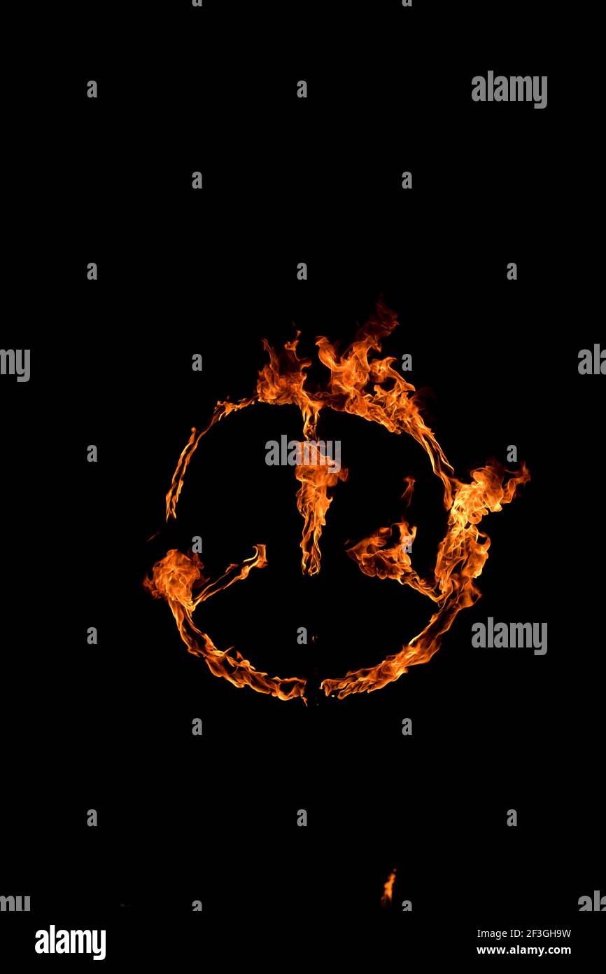 Burning peace symbol over black background Stock Photo - Alamy