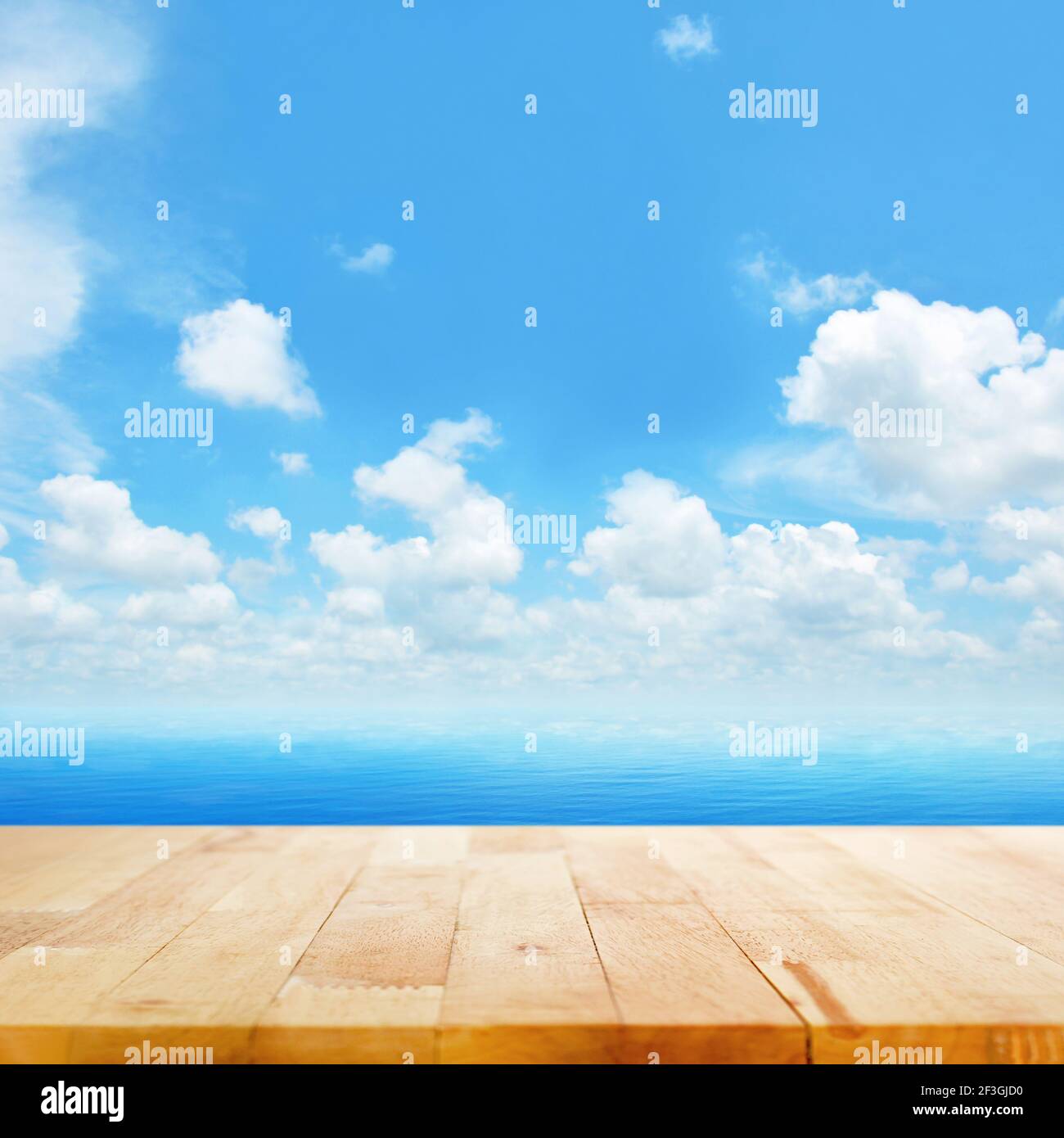 Wood table top on blue sea water and bright summer sky background - can ...