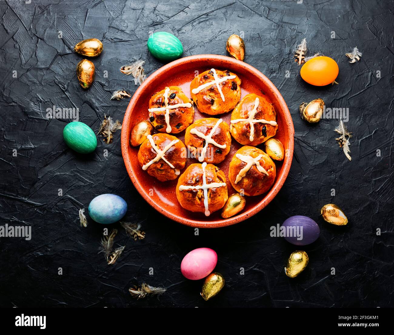 Easter hot cross buns and holiday decor.Traditional English Easter buns ...