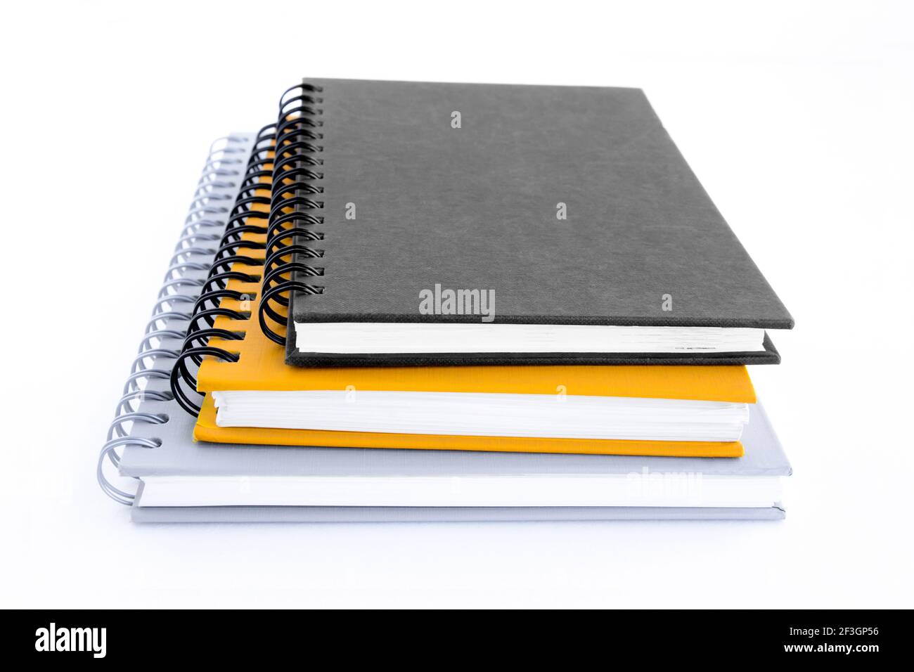 Stack of notebooks or copybooks on white background Stock Photo - Alamy