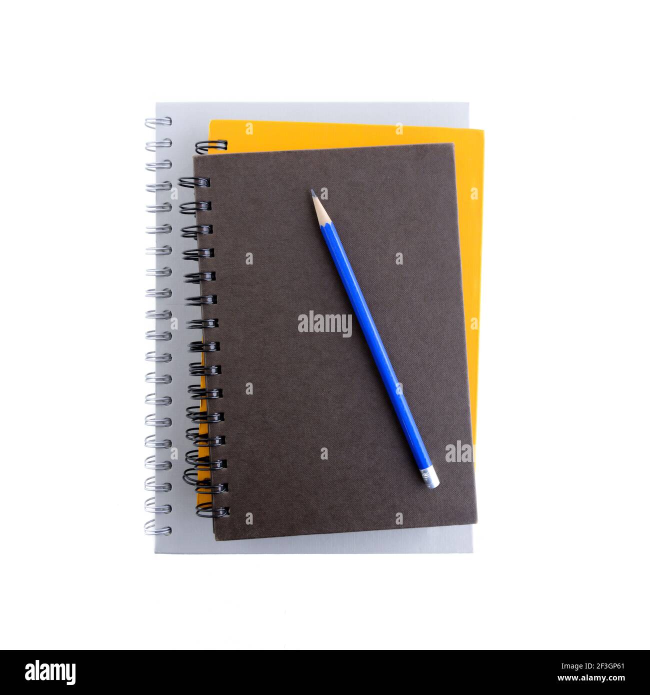Stack of notebooks or copybooks with pencil on top - isolated on white ...