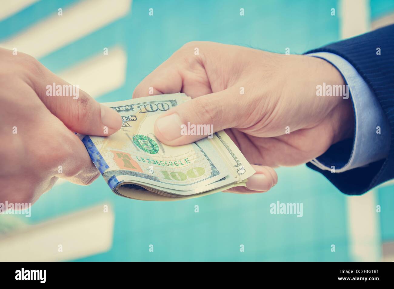 Hands of businessmen passing money Stock Photo - Alamy