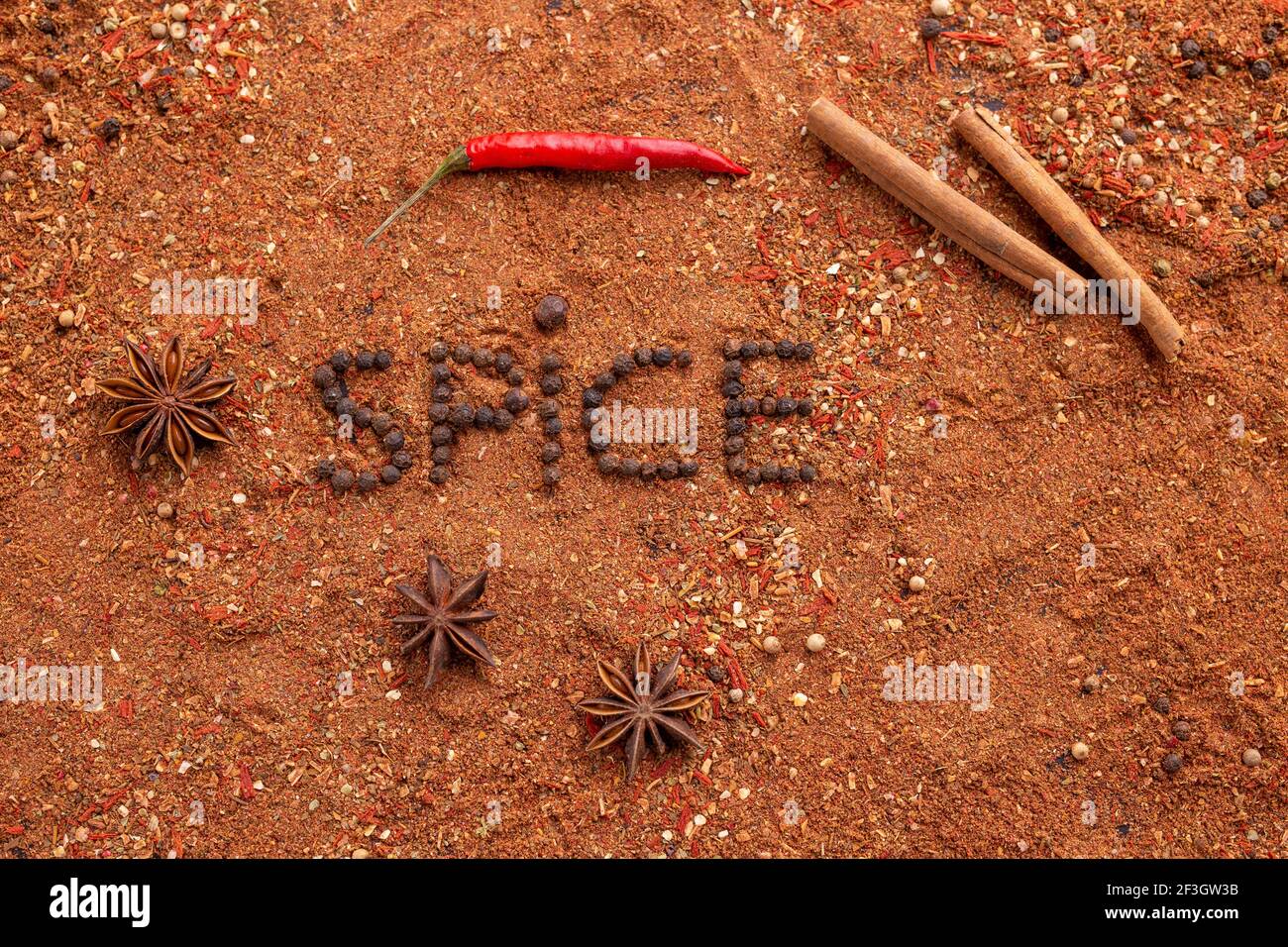 Top view of the inscription spices made from red capsicum ground pepper ...