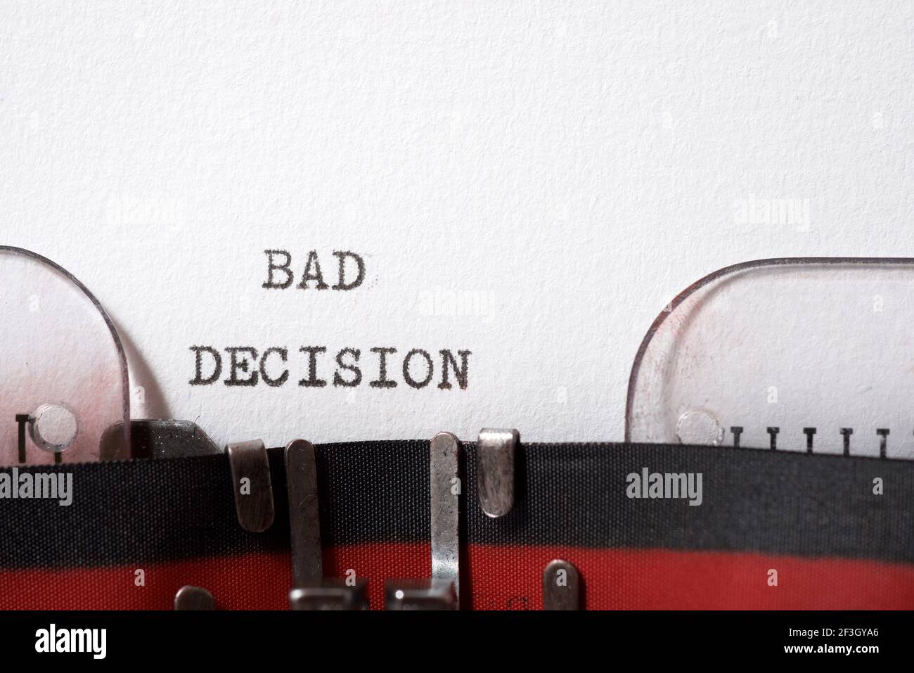 Bad decision phrase written with a typewriter Stock Photo - Alamy