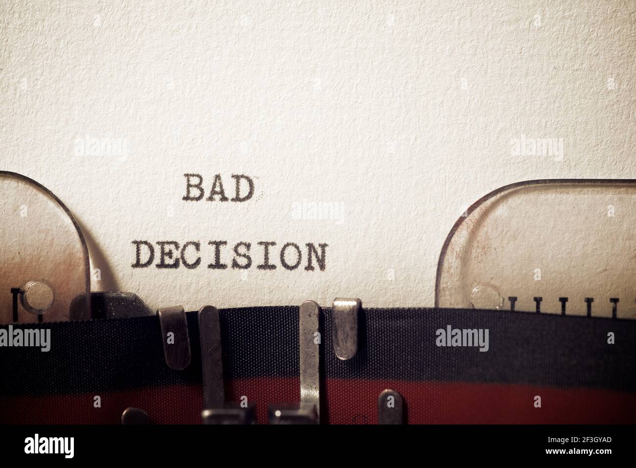 Bad decision phrase written with a typewriter Stock Photo - Alamy