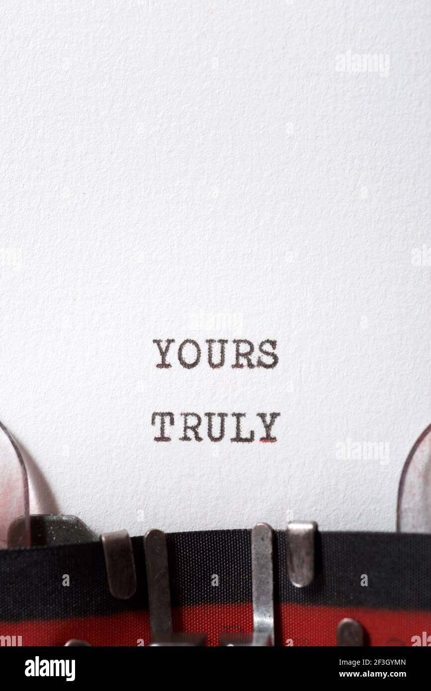 Yours truly phrase written with a typewriter Stock Photo - Alamy