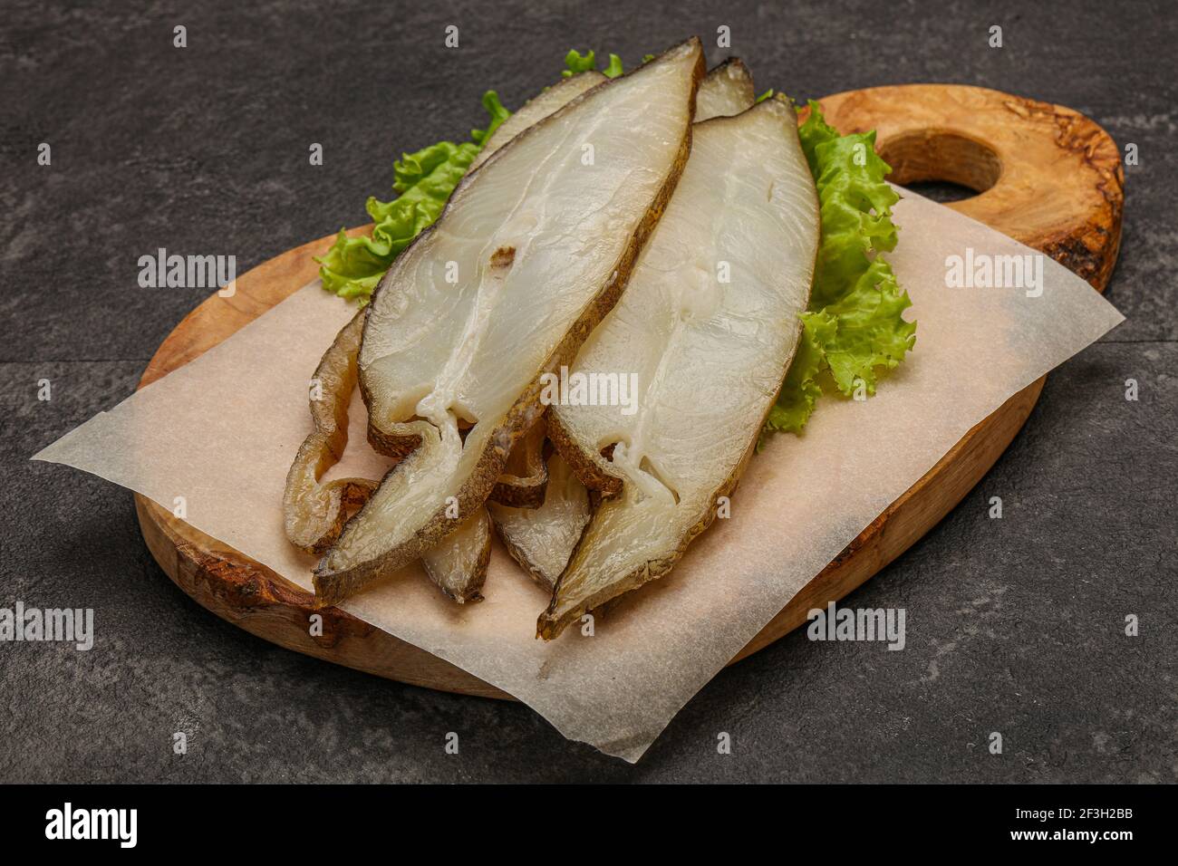 Delicous smoked halibut fish slices snack Stock Photo - Alamy