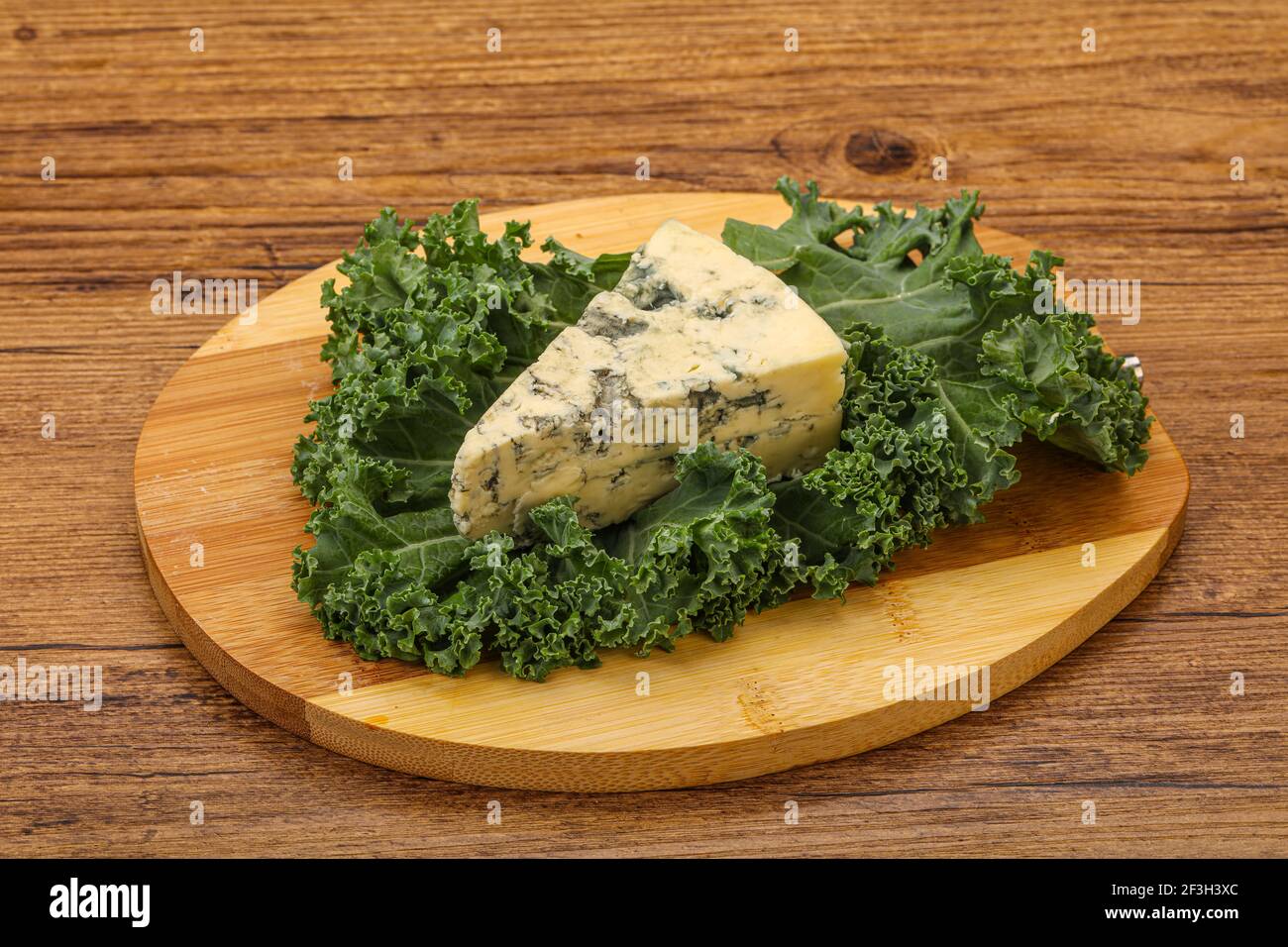 Dairy Blue cheese triangle with mold Stock Photo - Alamy