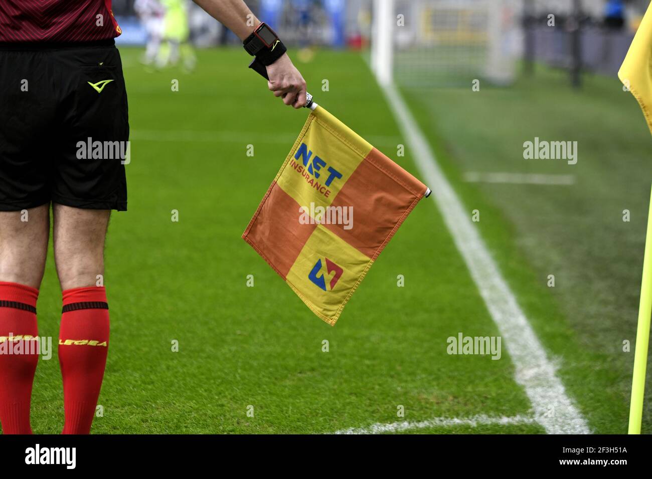 Football linesman referee wave the flag to point the corner, at the san siro stadium, in Milan ...