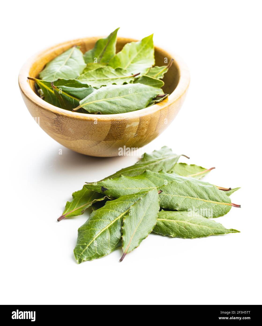 Fresh green bay leaves in bowl isolated on white background Stock Photo ...