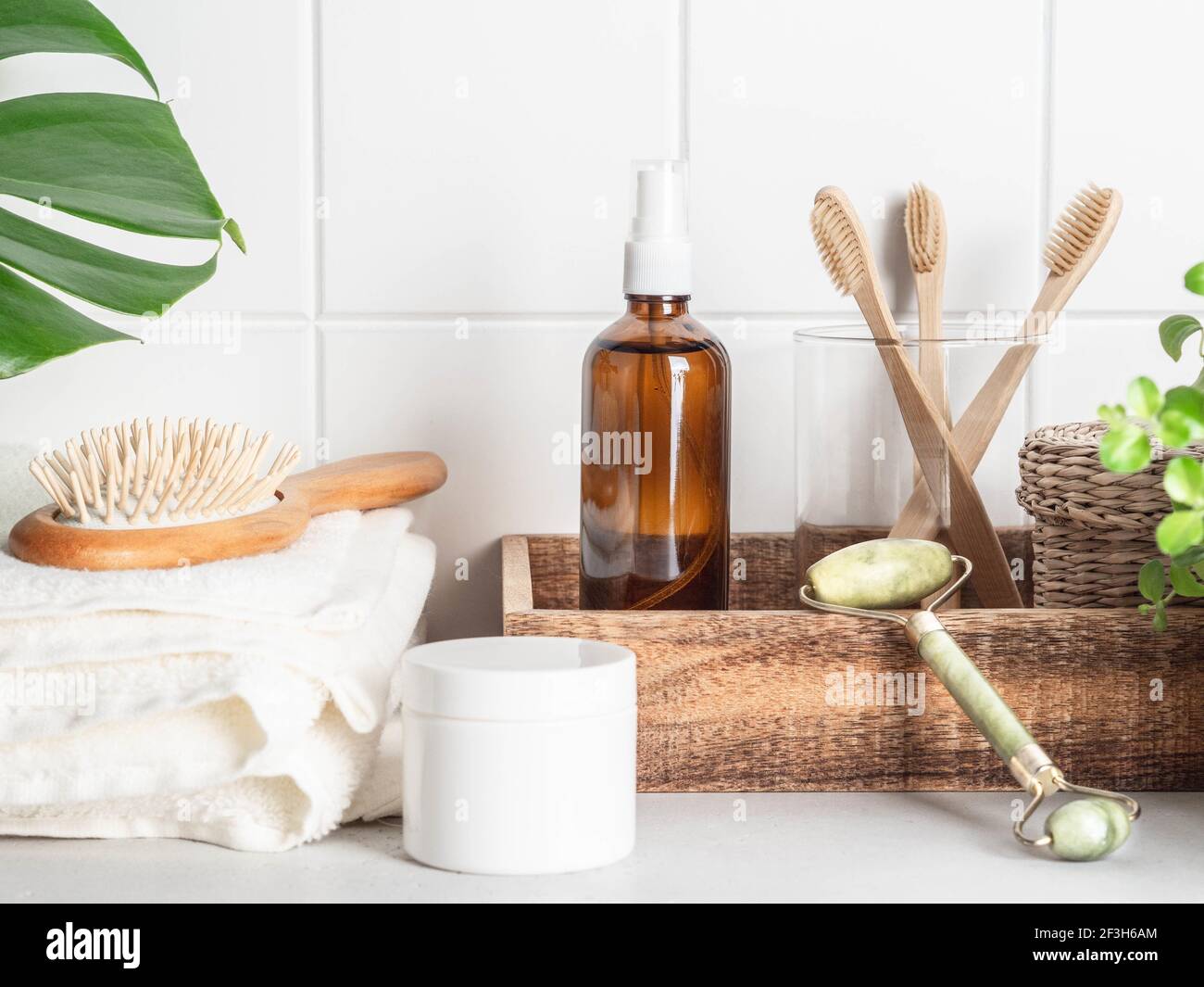 White bath background front view with cosmetic bottle, bath accessories ...