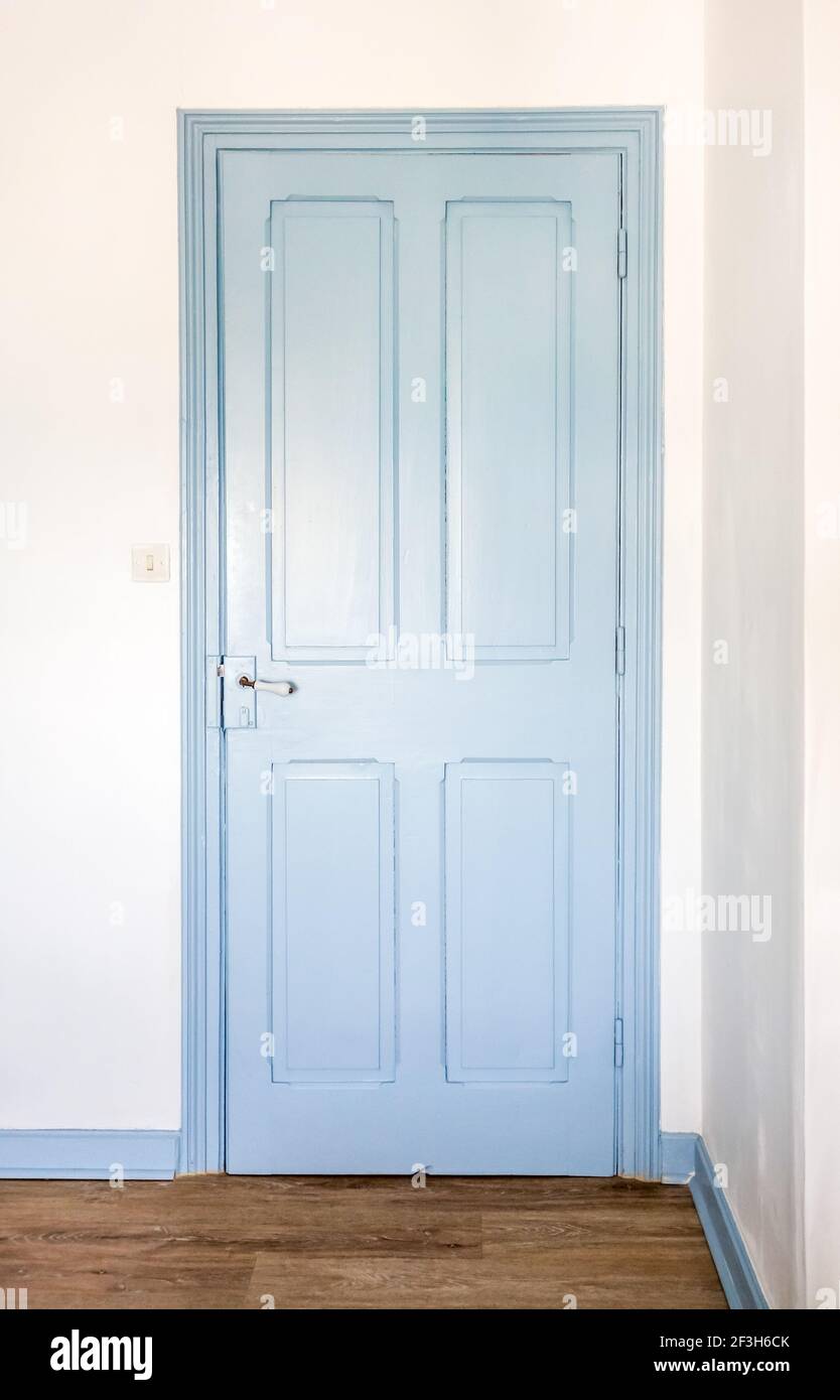 Rustic blue door in a house interior Stock Photo - Alamy
