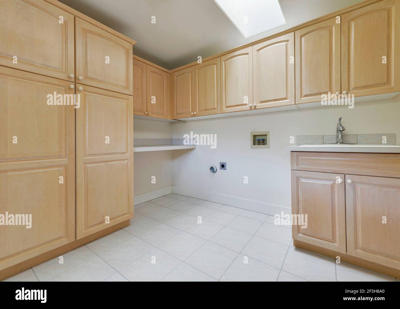 Modern residential laundry room interior Stock Photo - Alamy