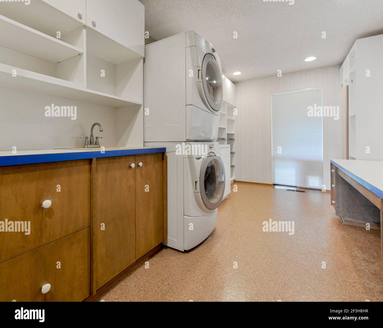 Modern residential laundry room interior Stock Photo - Alamy