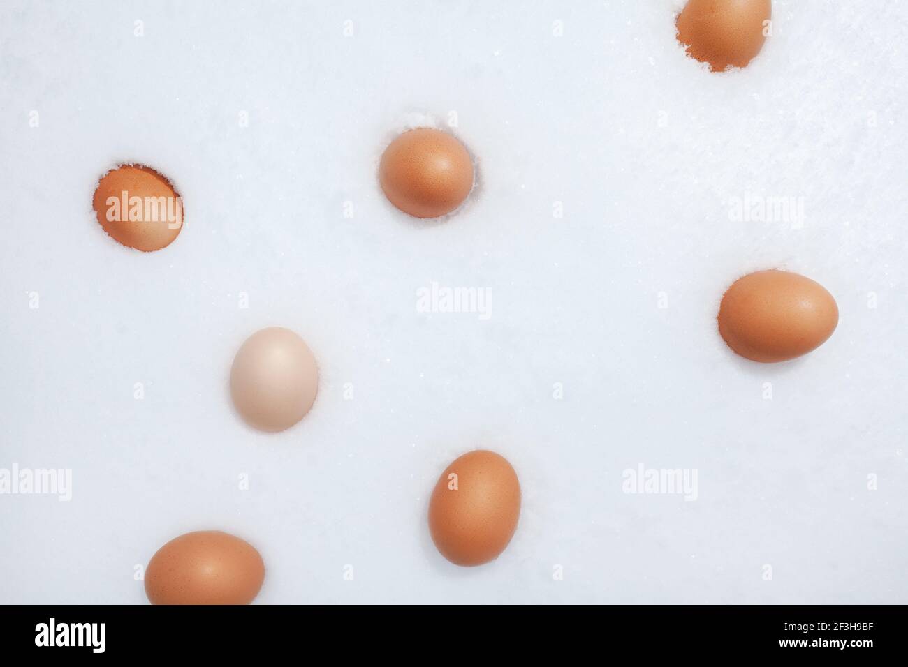 Chicken eggs in the snow. A modern composition about village life ...