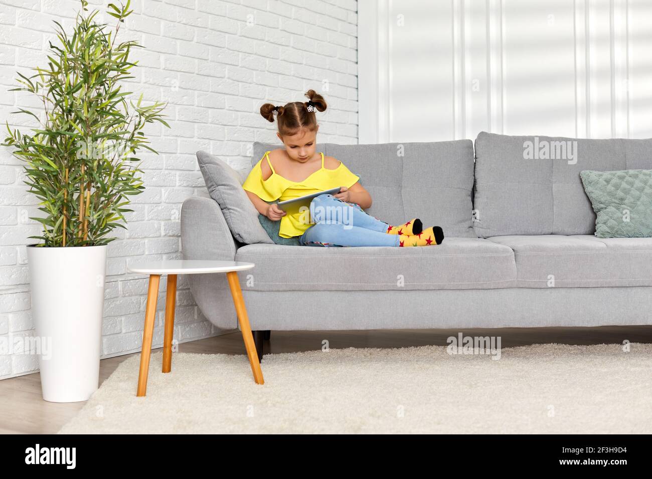 little child girl using digital tablet Stock Photo - Alamy