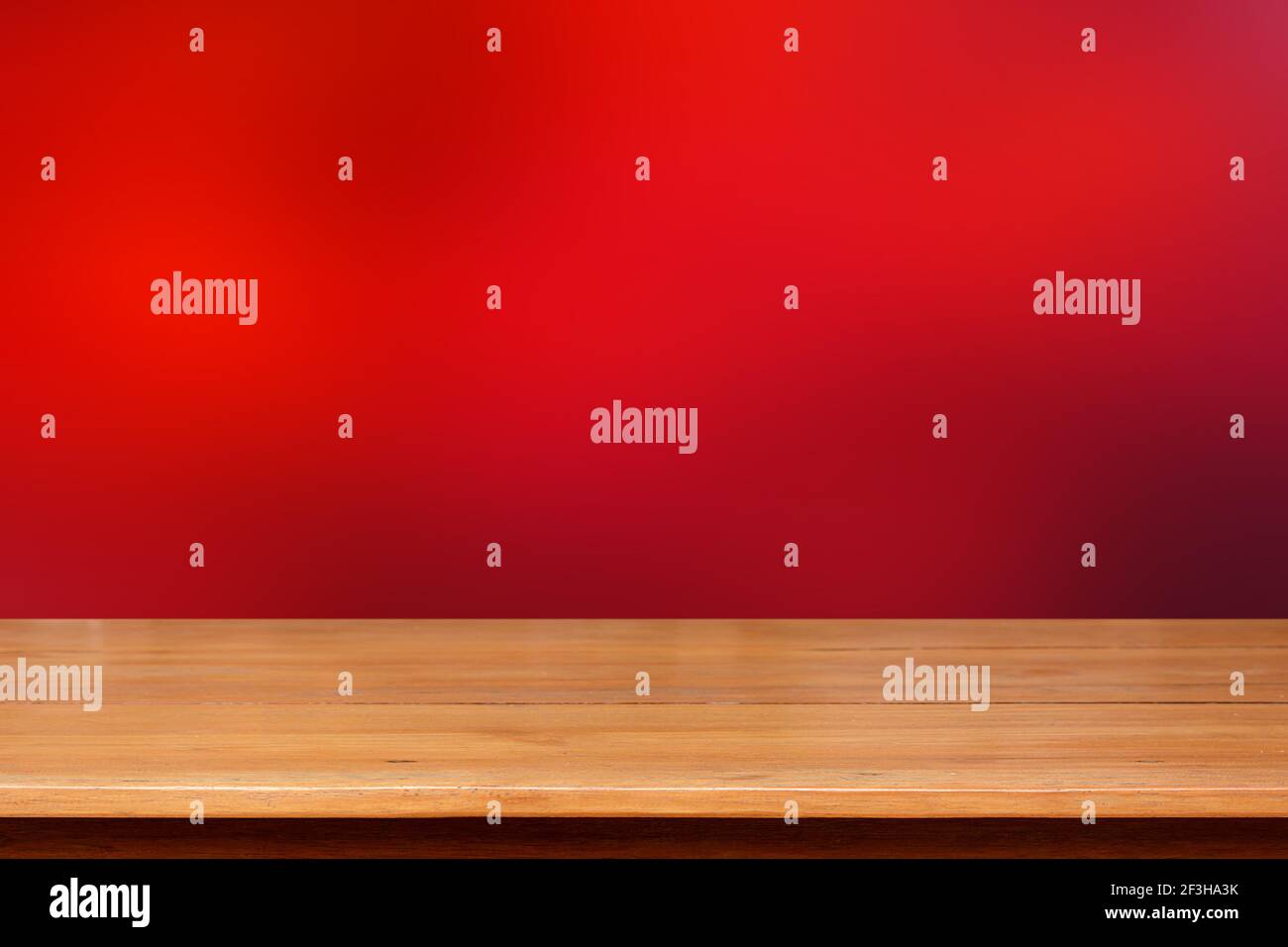 Wood table top on dark red abstract background Stock Photo - Alamy