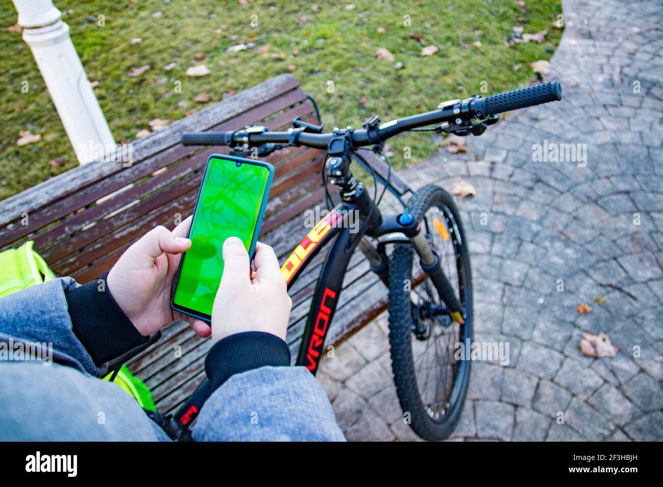 Delivery man checking smartphone for directions Stock Photo - Alamy