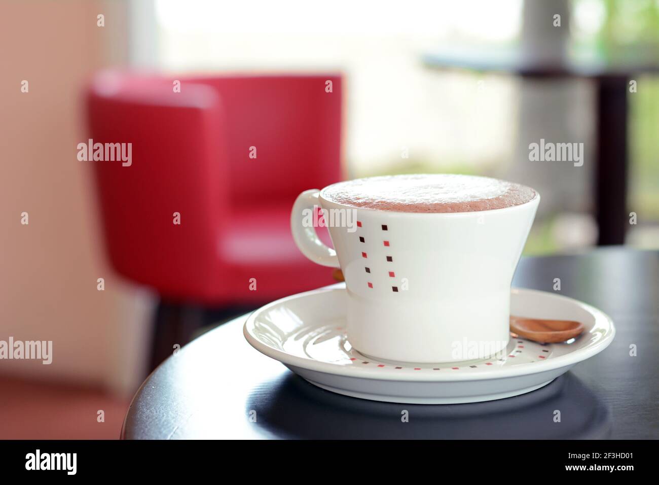 Coffee cup on the table in coffee shop Stock Photo - Alamy