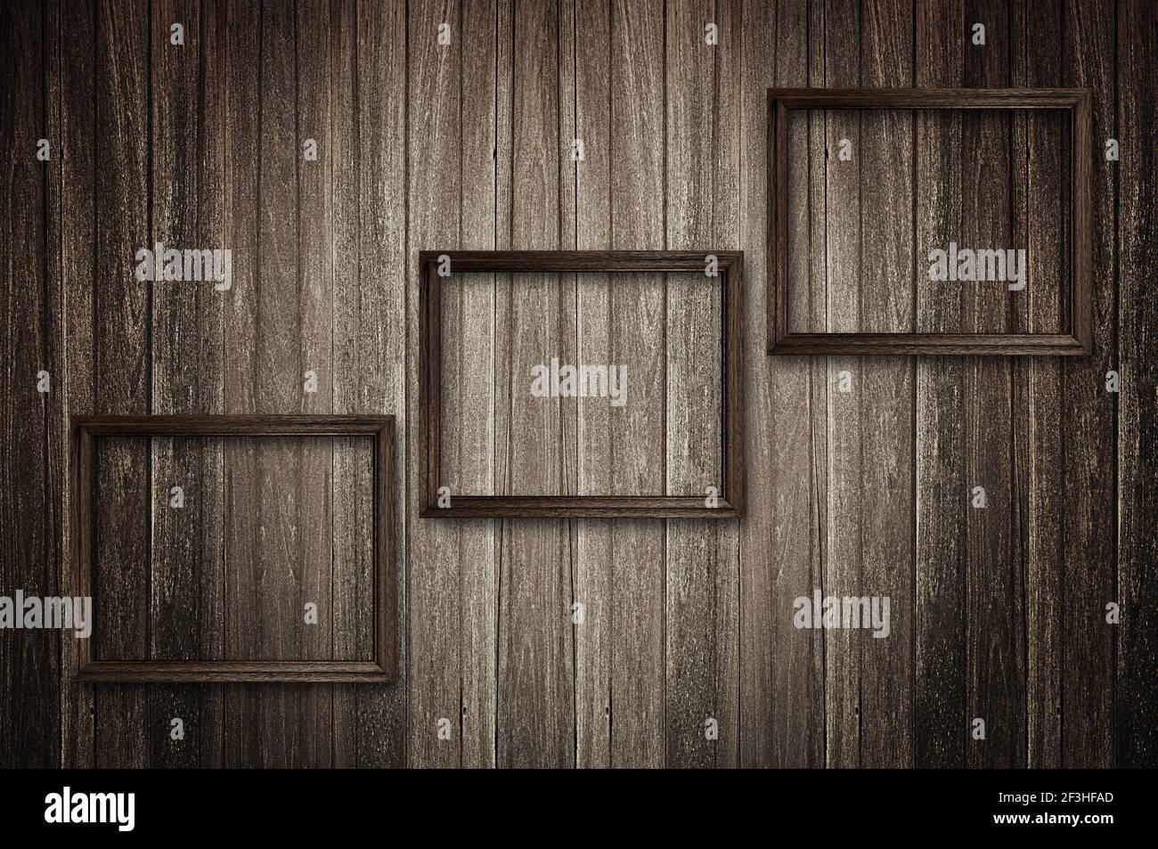Picture frames on dark wooden wall Stock Photo - Alamy