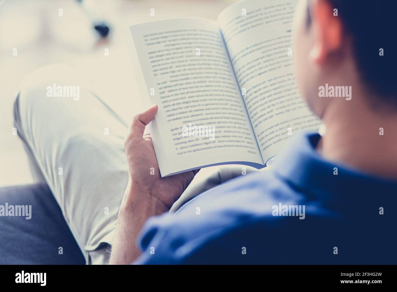 Asian man reading Stock Photo - Alamy