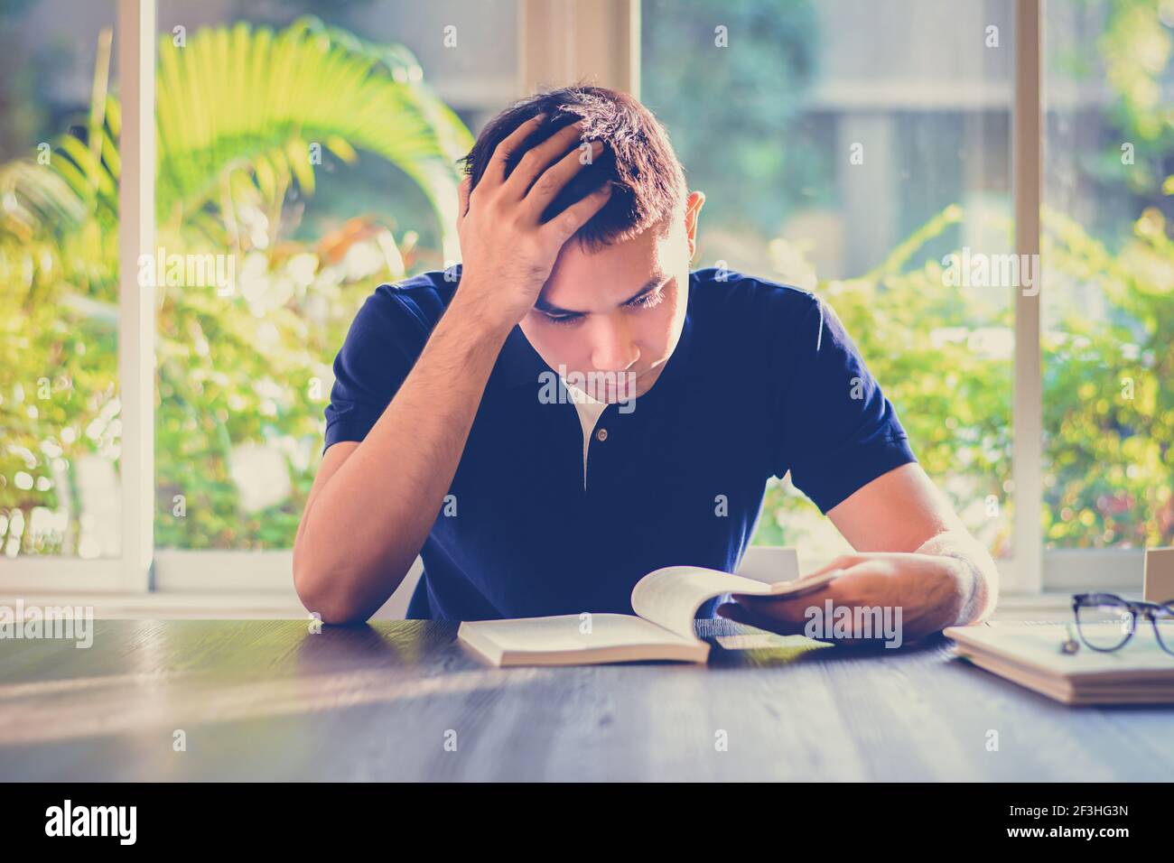 serious man reading Stock Photo - Alamy