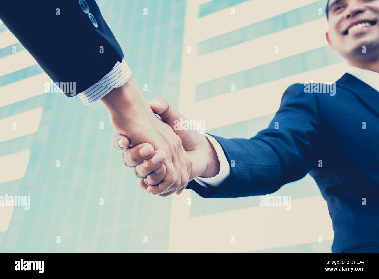 Handshake of businessmen with smiling face, greeting, dealing ...
