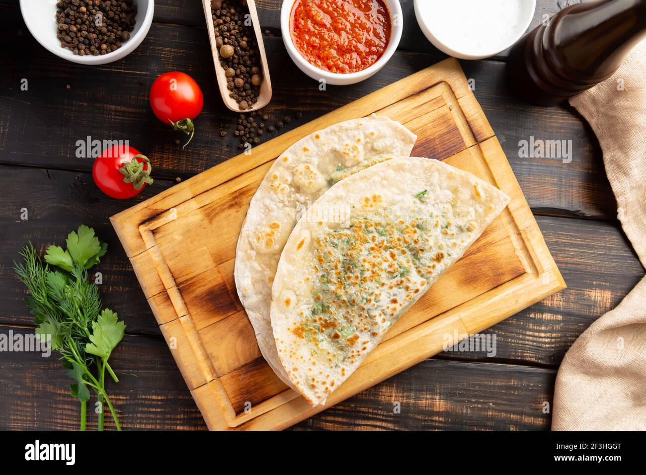 Azerbaijani national dish gutab with meat and vegetables together with ...