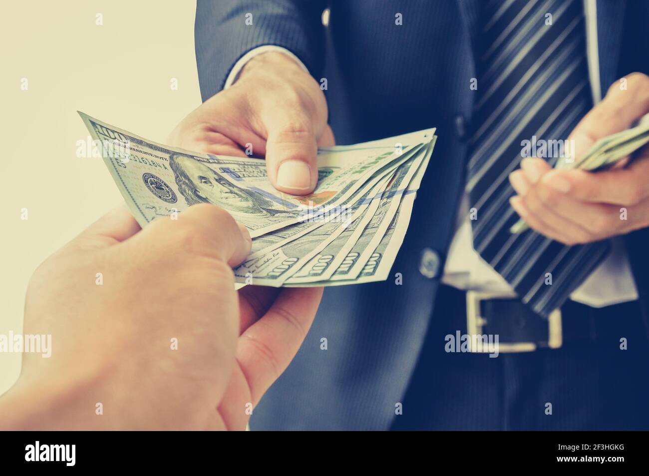 Hand receiving money, US dollars, from business man - vintage (retro ...