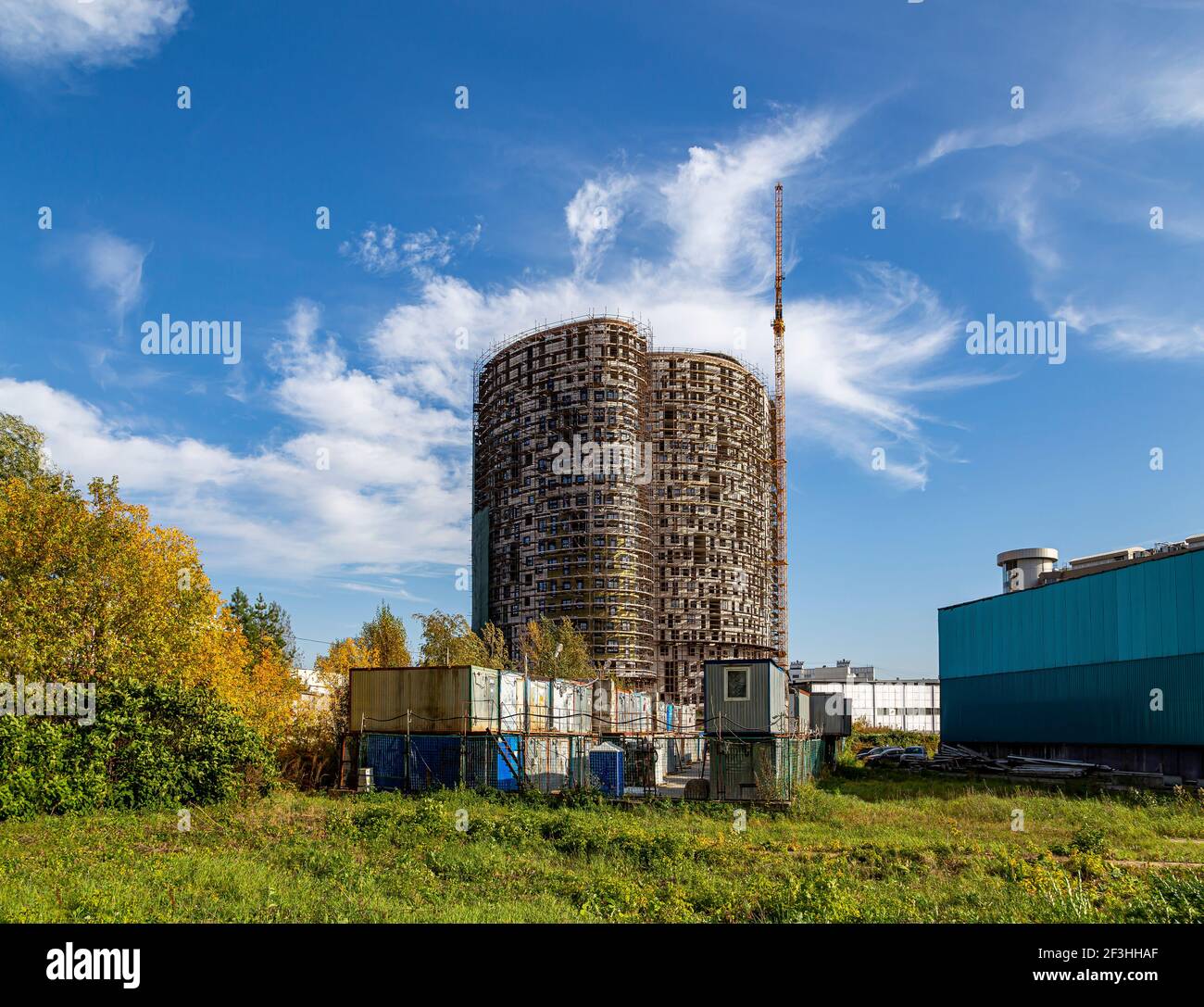 Multi-storey building under construction with scaffolding (new ...