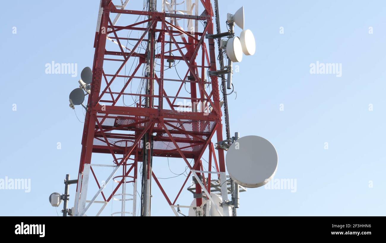 Telecommunication Cellular Tower Against Blue Sky Stock Photo - Alamy