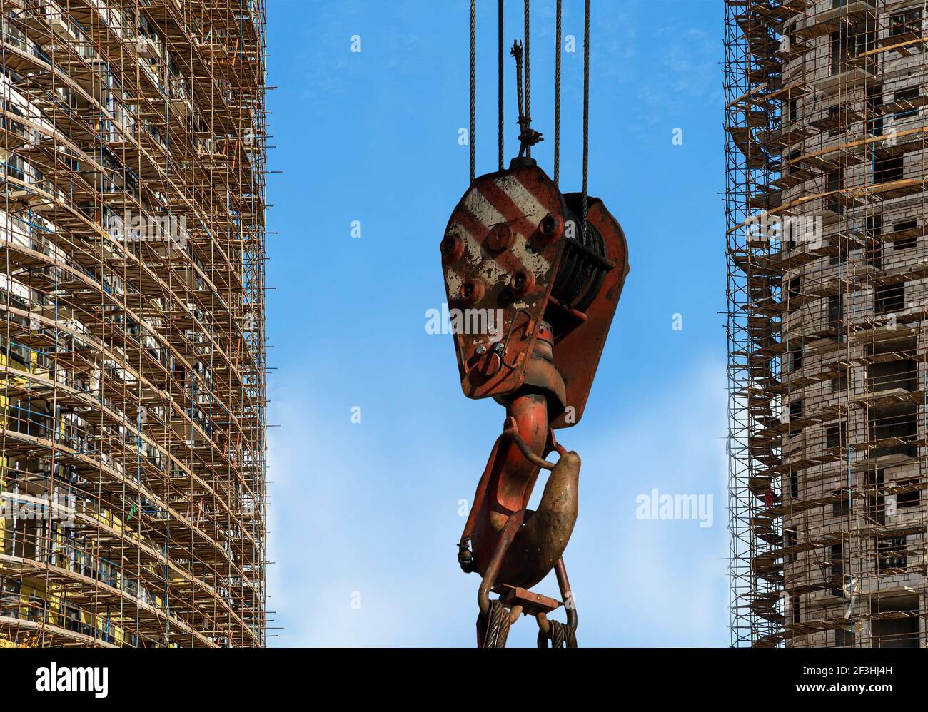 Multi-storey building under construction with scaffolding (new ...