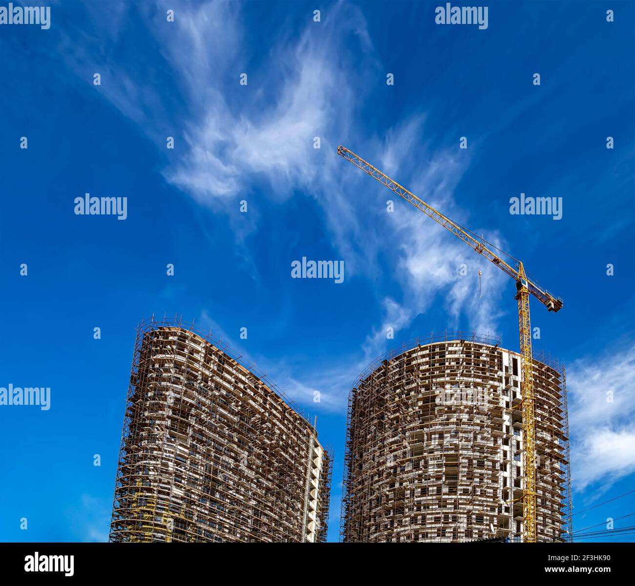 Multi-storey building under construction with scaffolding (new ...