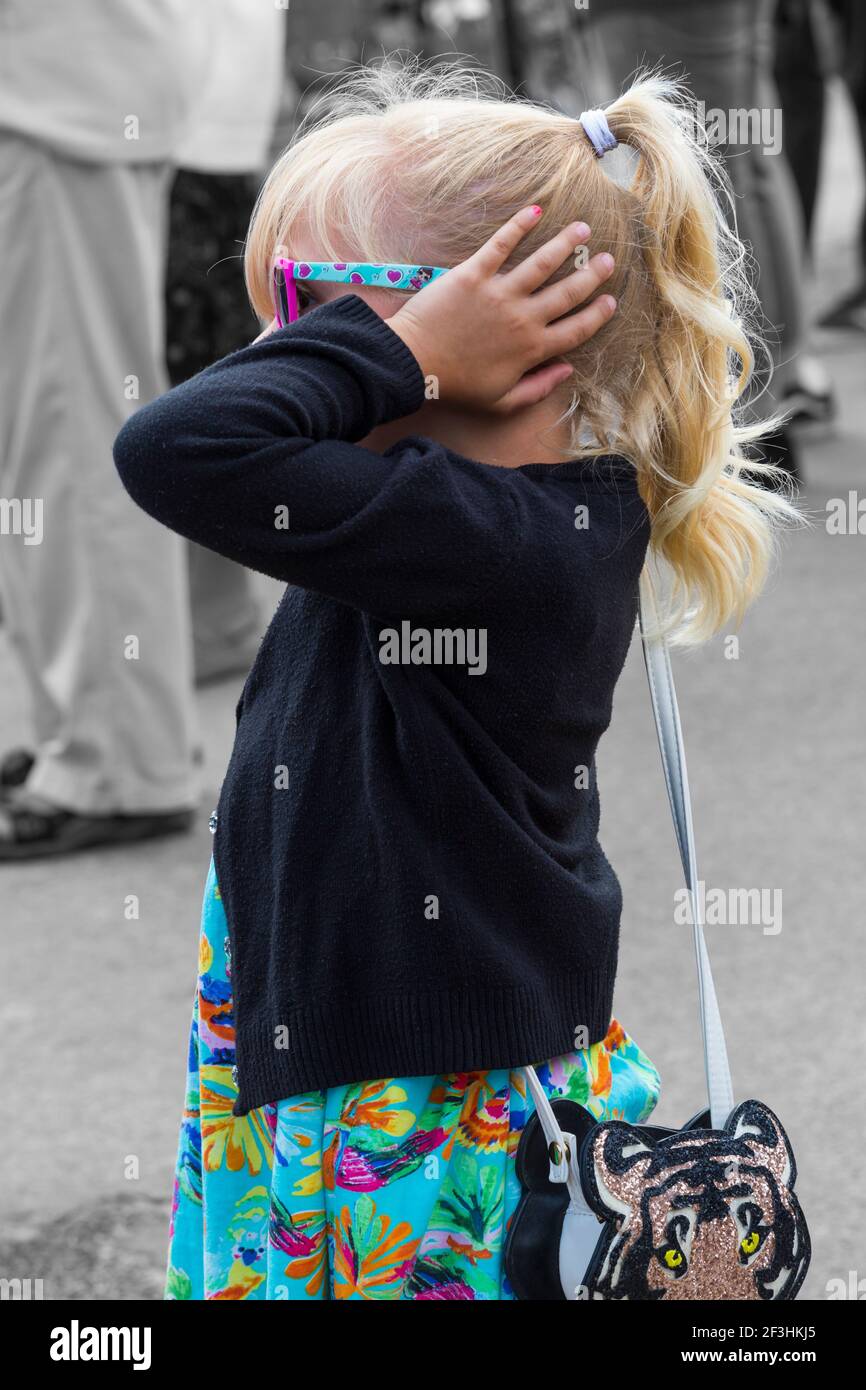 Child with hands over ears hi-res stock photography and images - Alamy