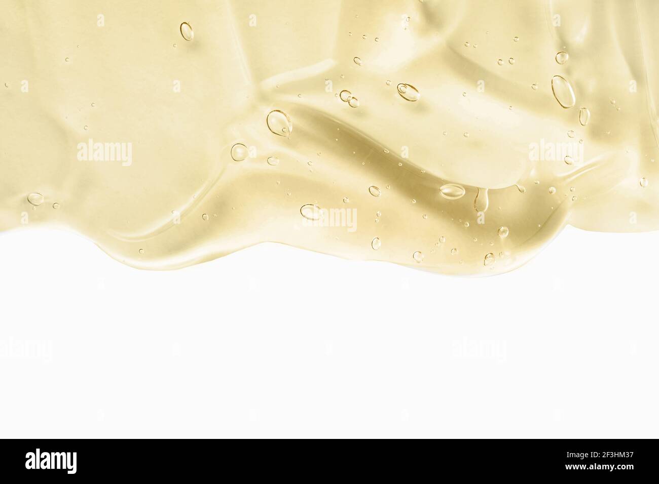 Cosmetic cream transparent liquid gel. Yellow gel smudge isolated on ...