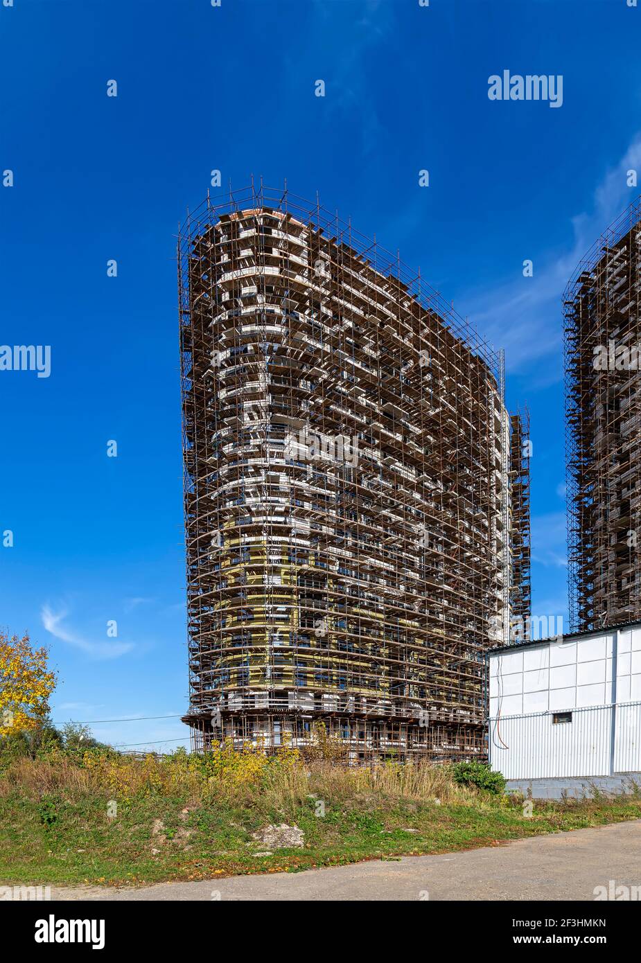 Multi-storey building under construction with scaffolding (new ...