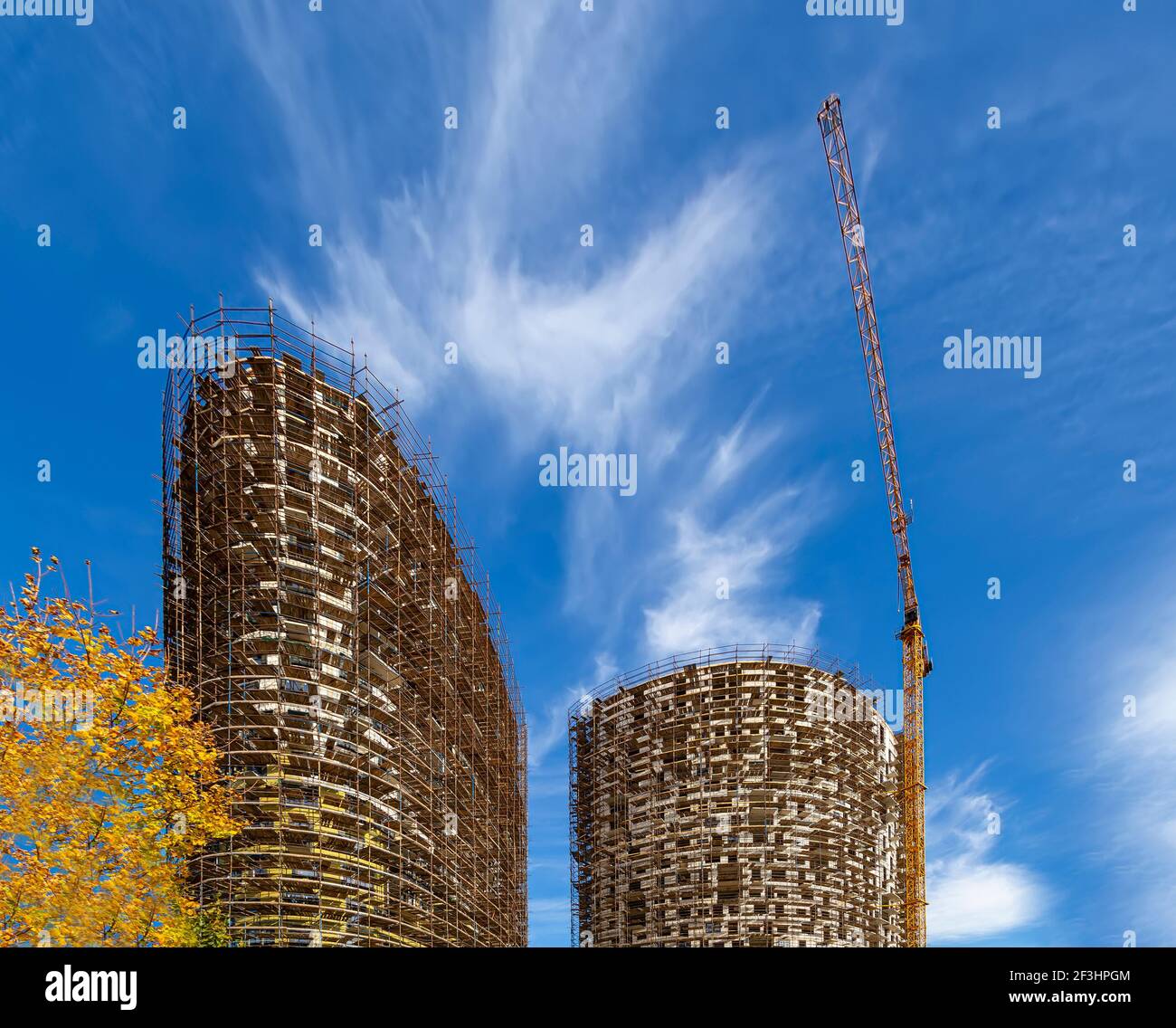 Multi-storey building under construction with scaffolding (new ...