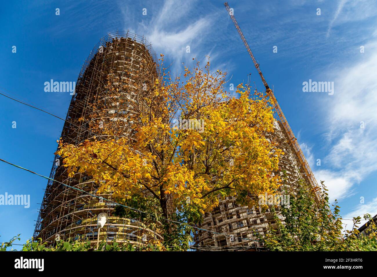 Multi-storey building under construction with scaffolding (new ...