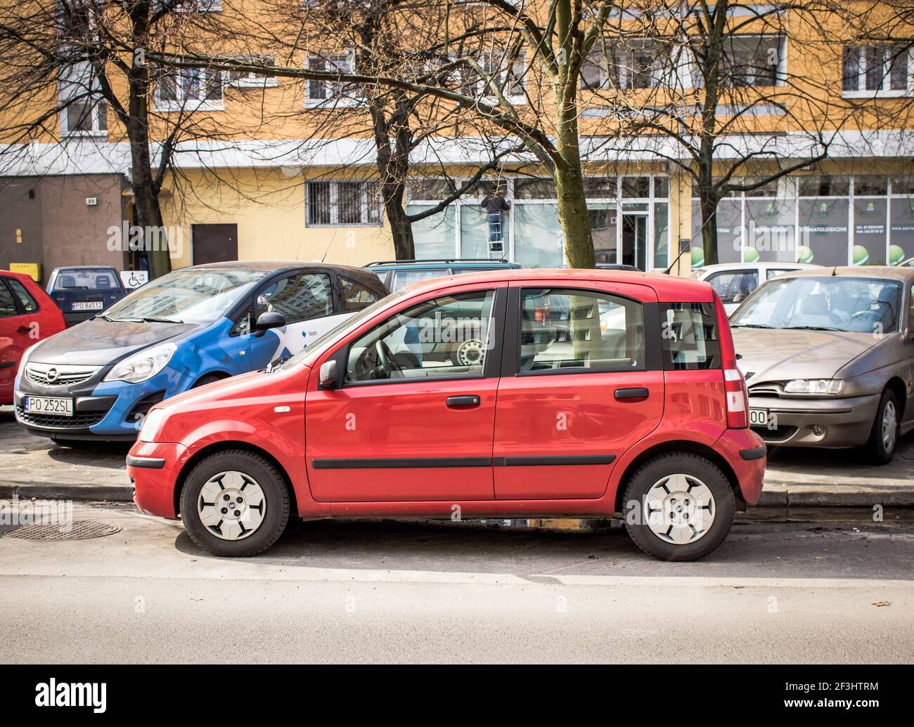 POZNAN, POLAND - Mar 27, 2014: Parked red Fiat Panda at a parking lot ...