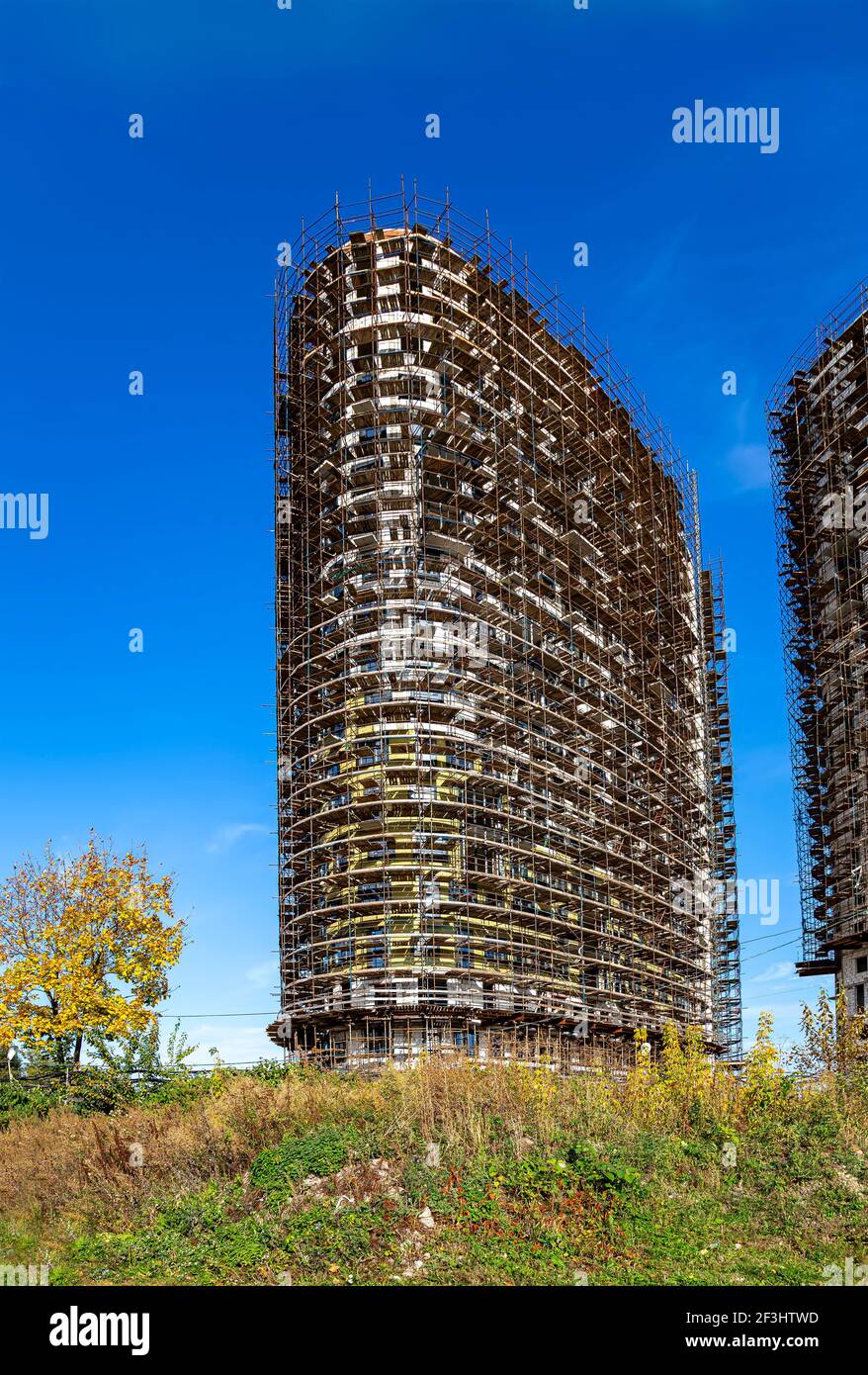 Multi-storey building under construction with scaffolding (new ...