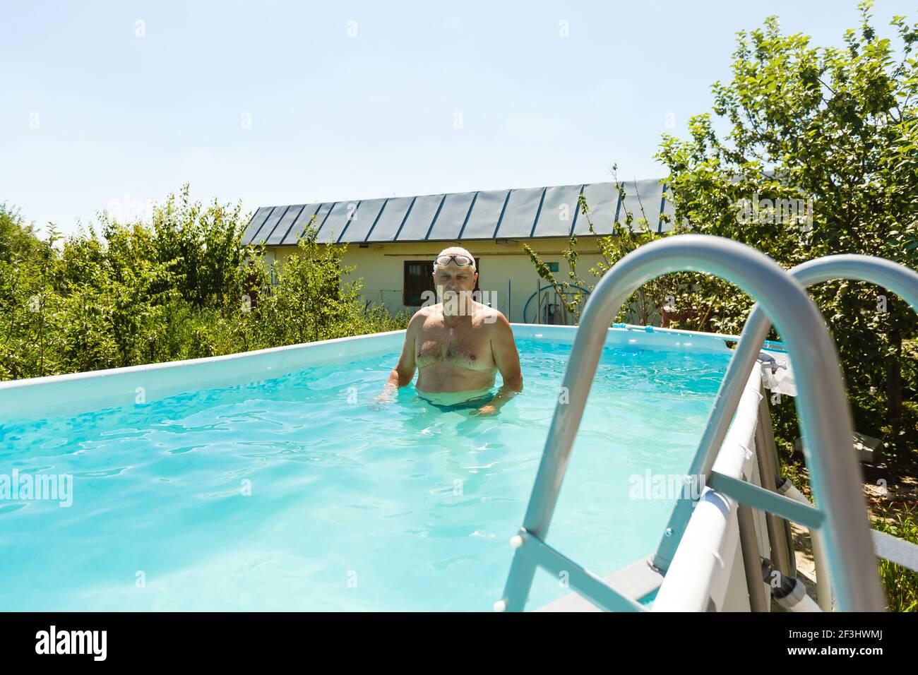 frame pool in the garden of a private house, summer Stock Photo - Alamy