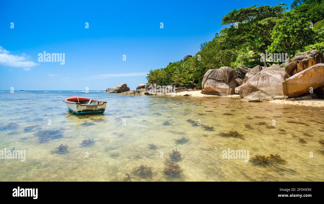 Beautiful tropical landscape of a rocky beach with boulders and green ...