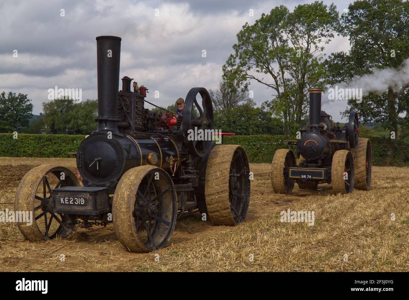 A pair of Fowler steam ploughing engines at the edge of a field Stock ...