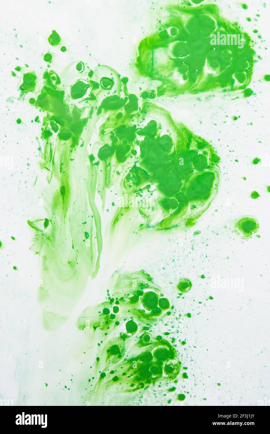 White wall with chaotic green paint drops Stock Photo - Alamy