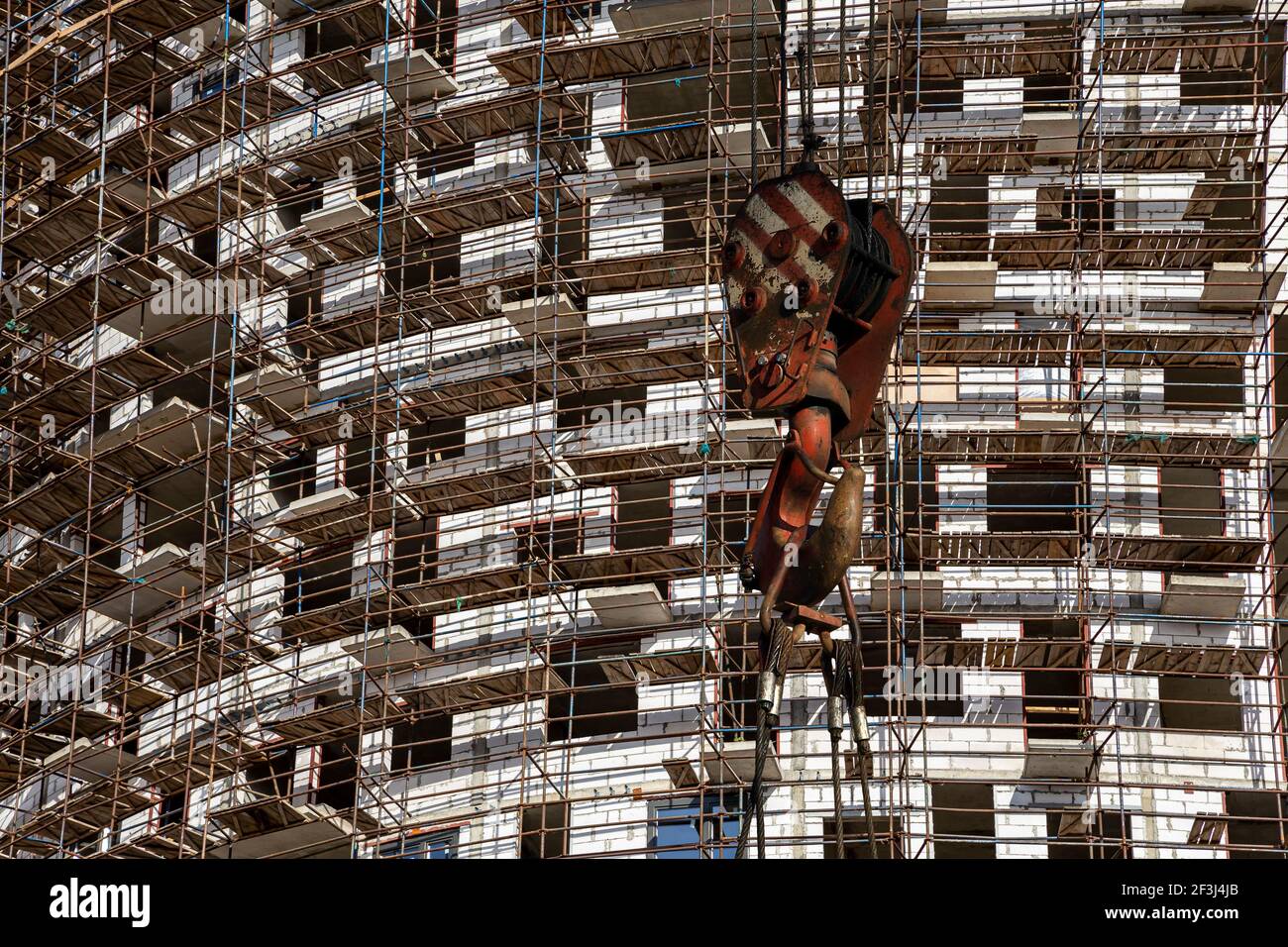 Multi-storey building under construction with scaffolding (new ...